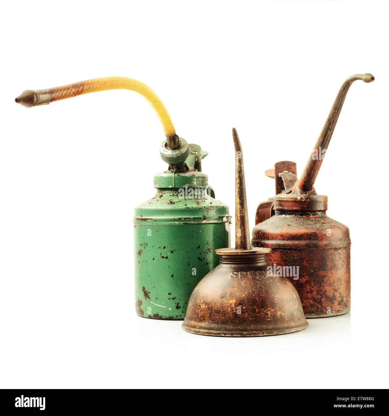 Three worn oil cans isolated on a white background Stock Photo - Alamy