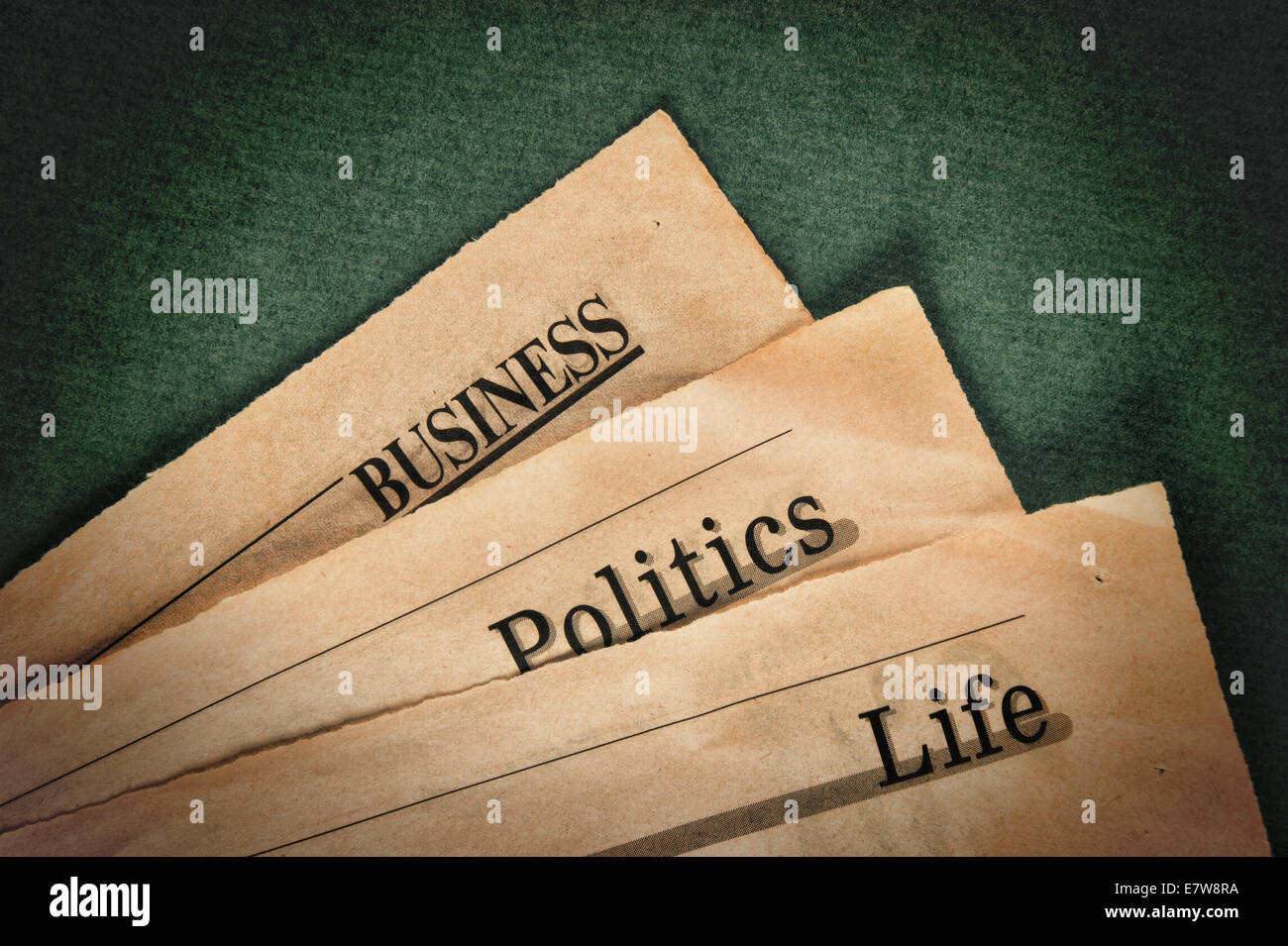 old newspaper on a green background Stock Photo - Alamy