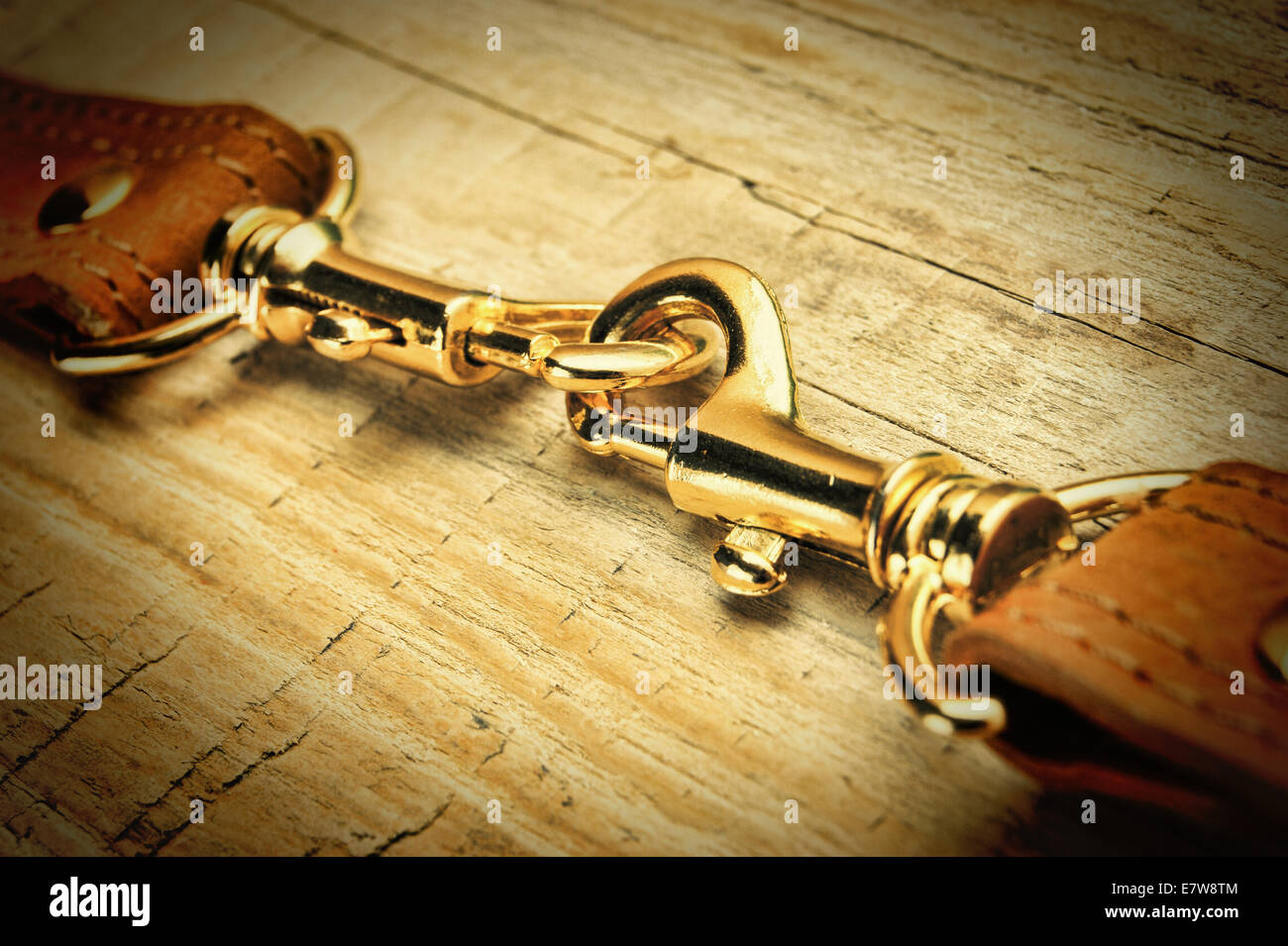 leather strap with carabiner on a wooden board Stock Photo - Alamy