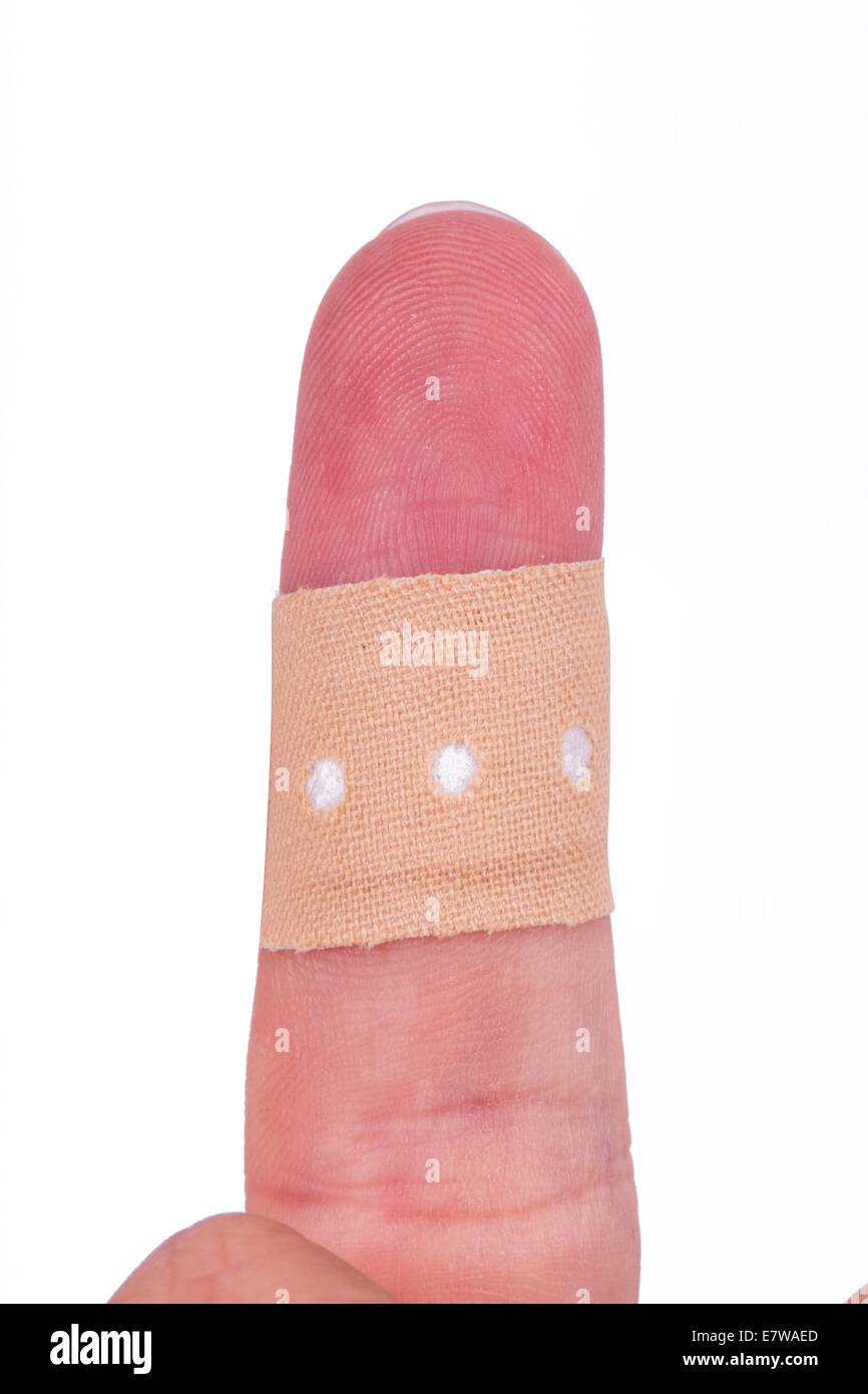Close up view of adhesive bandage, plaster on index finger, isolated on ...
