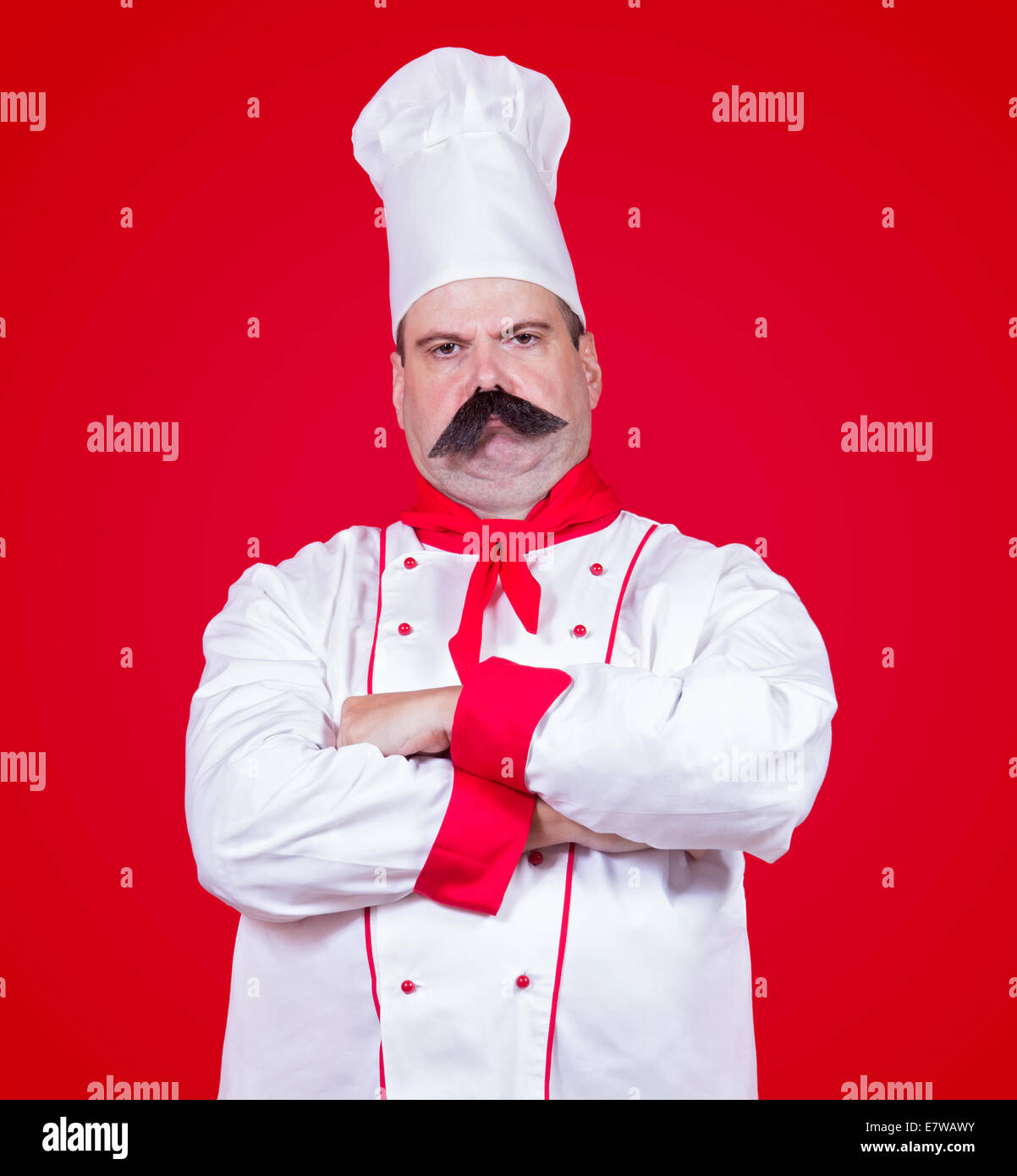 strict cook on red background Stock Photo - Alamy