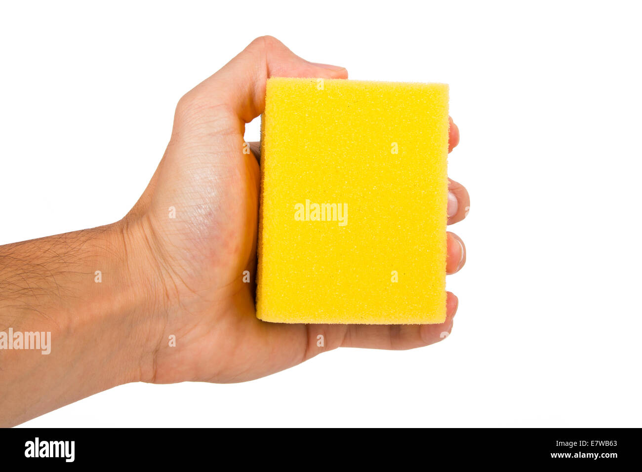 Hand holding yellow cleaning sponge, isolated on white background Stock ...