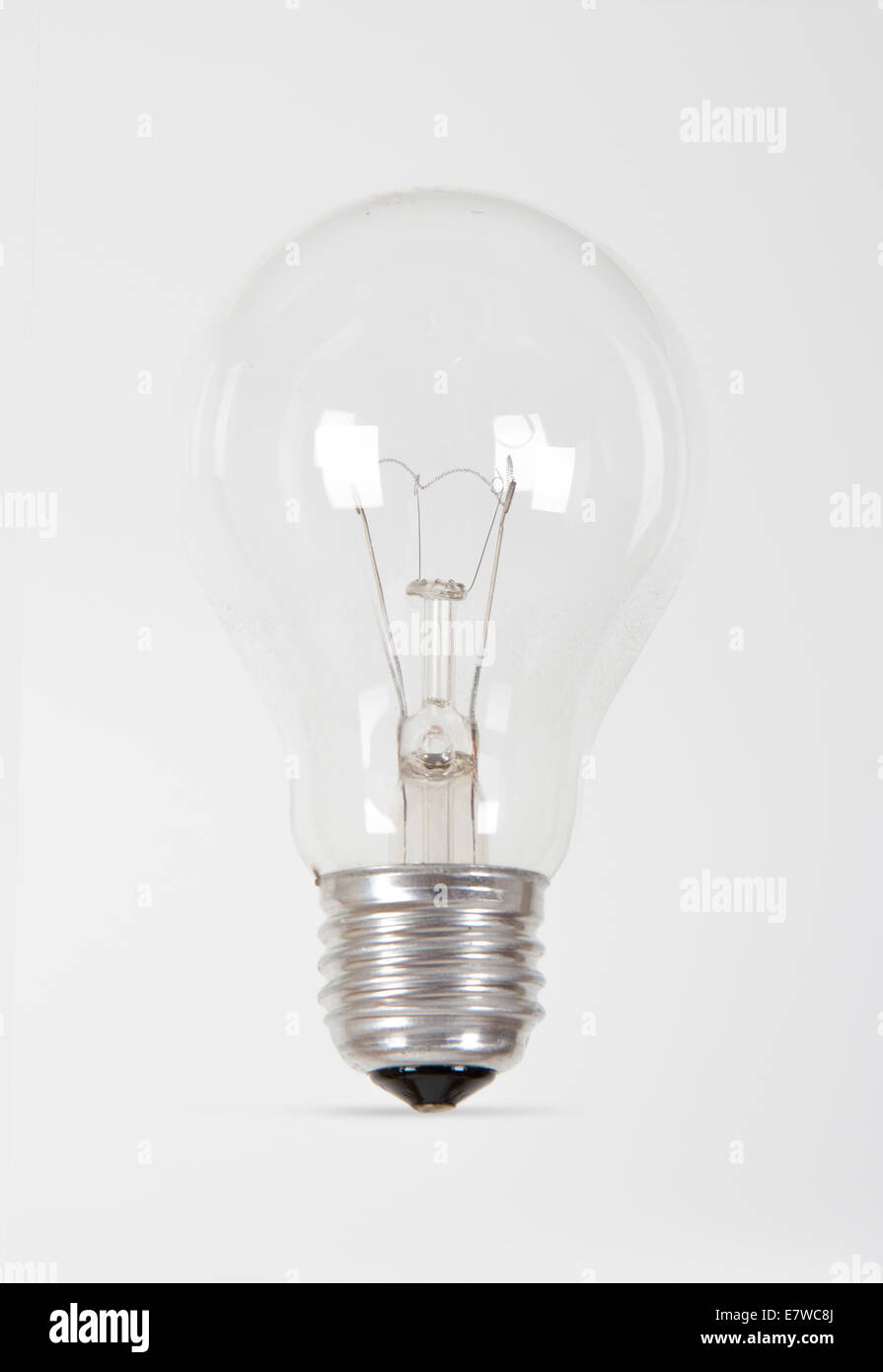 Single light bulb on white background Stock Photo - Alamy
