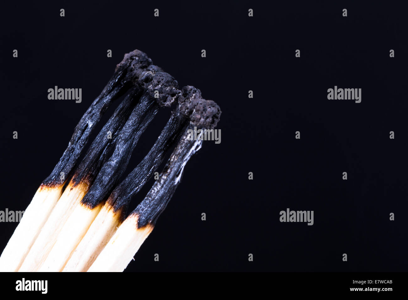 Group of burnt matches on dark background Stock Photo - Alamy