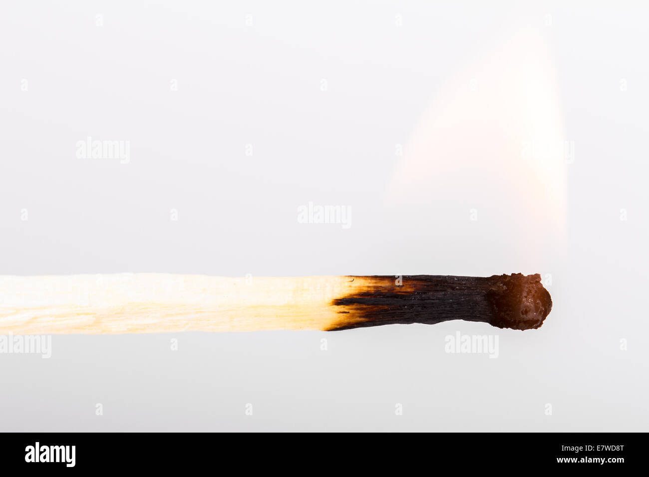 Match burning on white background Stock Photo - Alamy