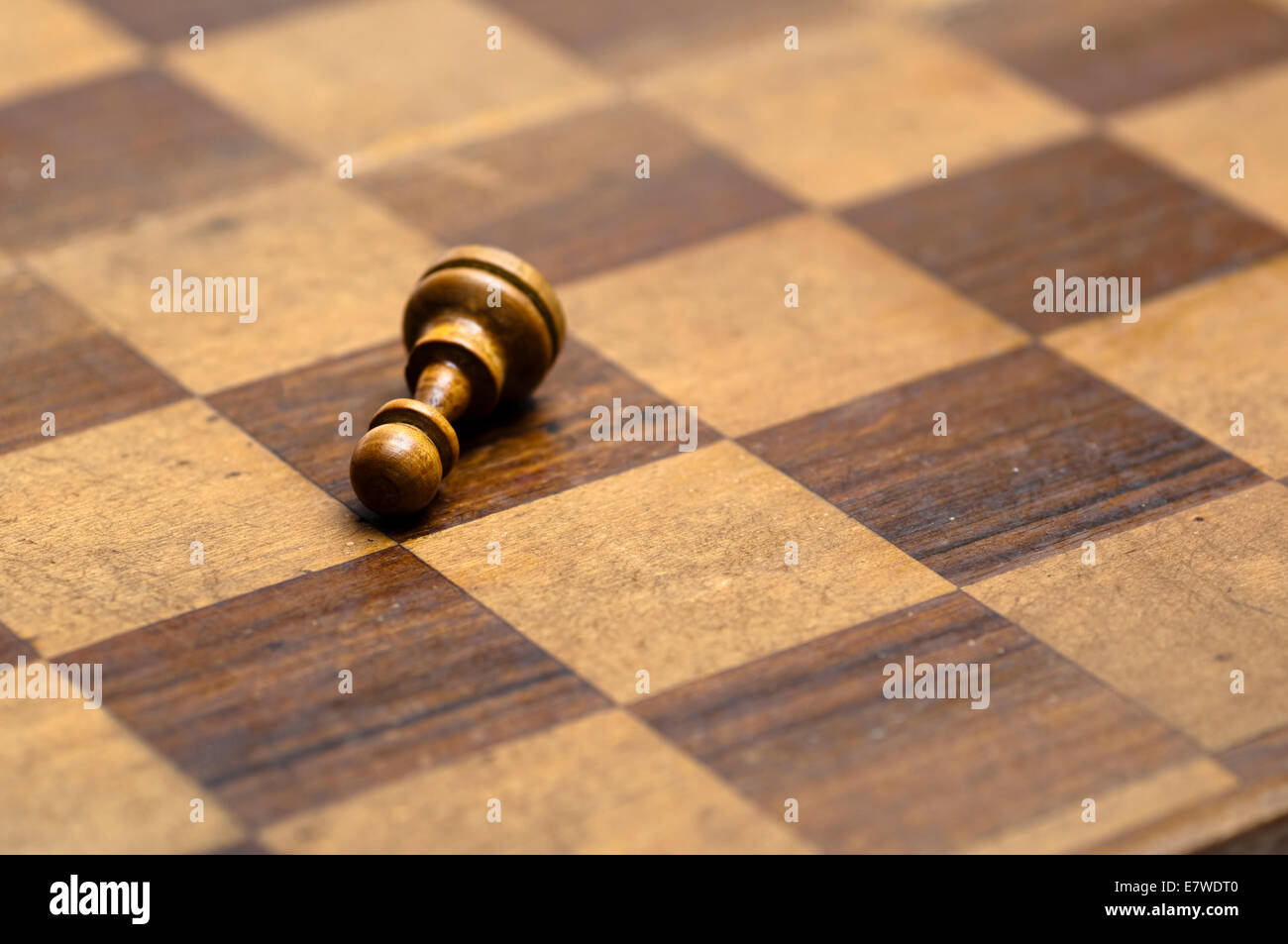 Chess pawn on an old chess board Stock Photo - Alamy