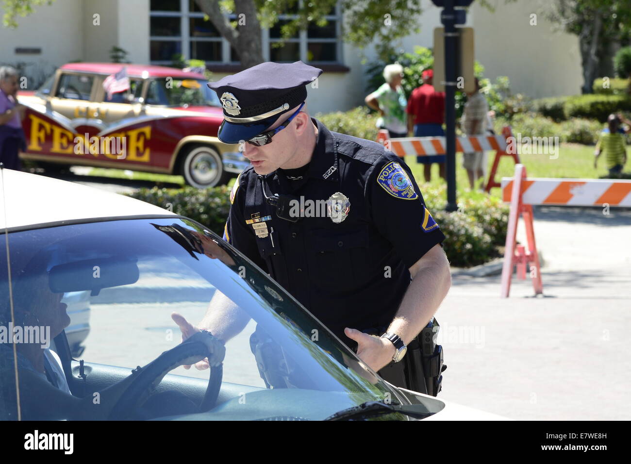 policeman-talking-with-a-driver-about-a-traffic-violation-stock-photo