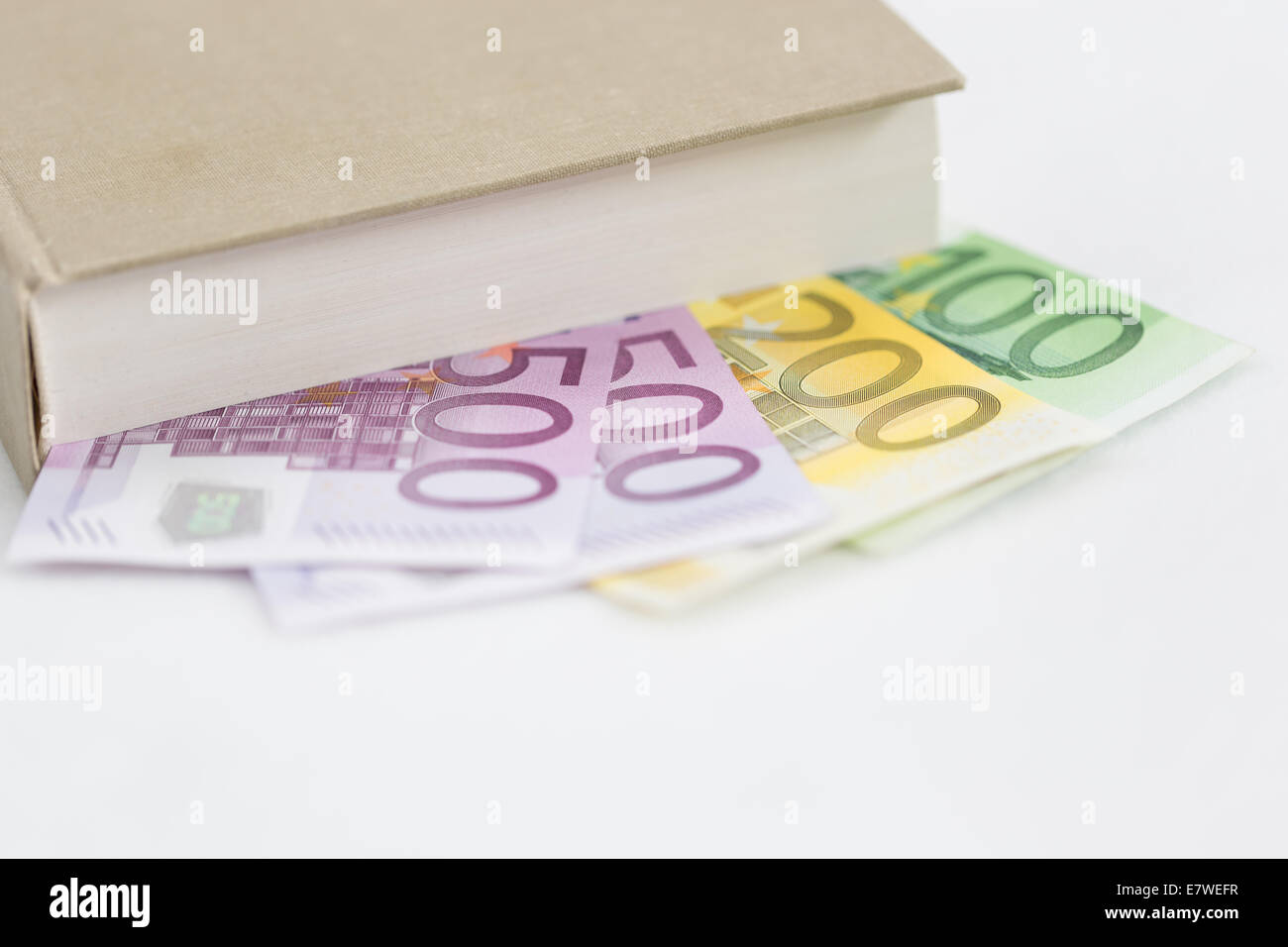 books with EUR banknotes inside Stock Photo - Alamy