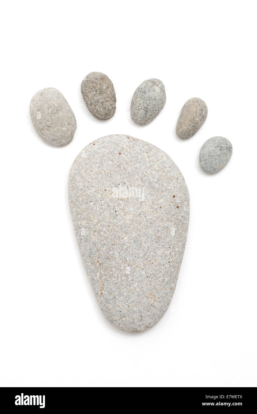 Foot shape made with sea stones Stock Photo - Alamy