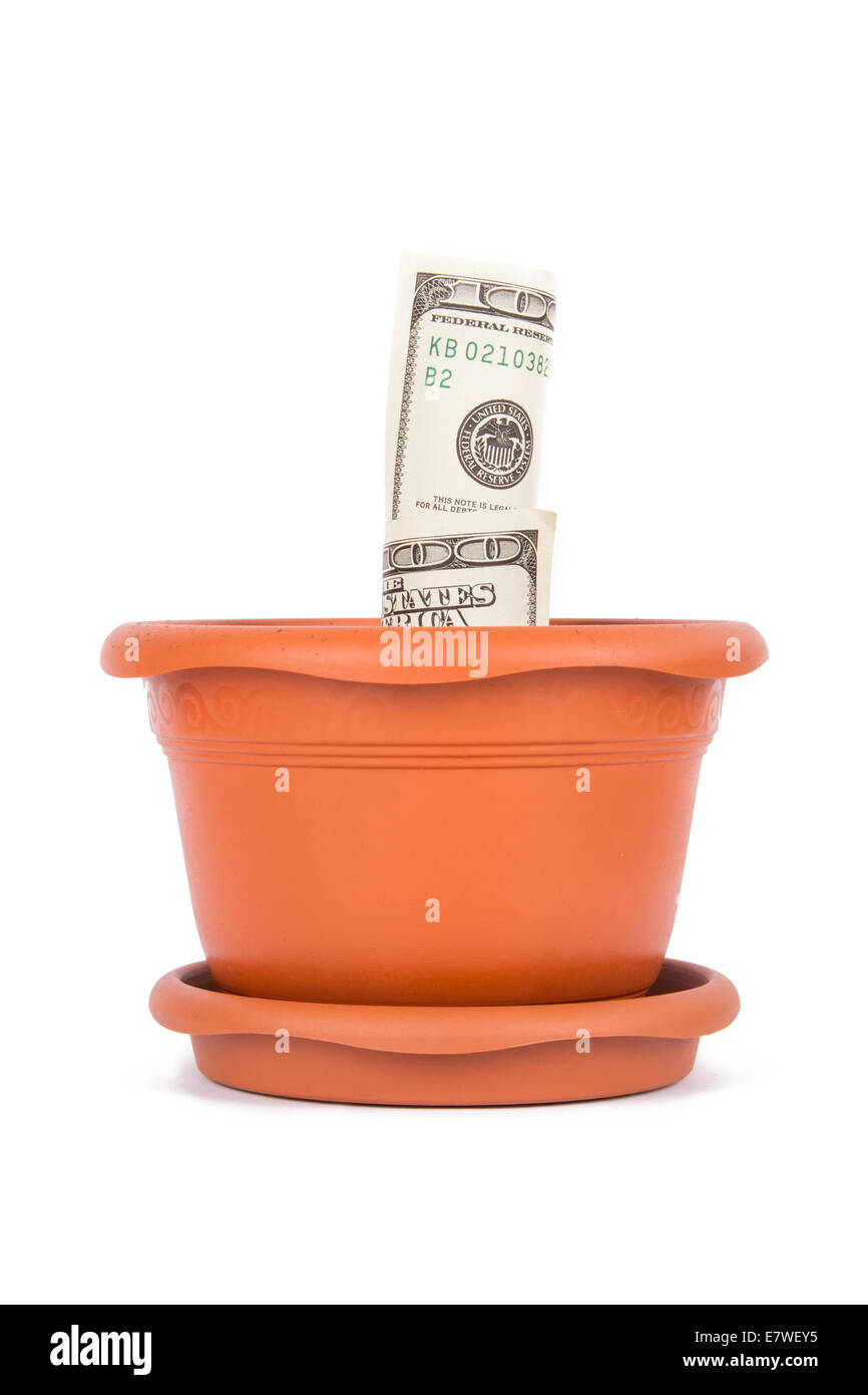 Flower pot and full of soil with one hundred dollar bills inside, front ...