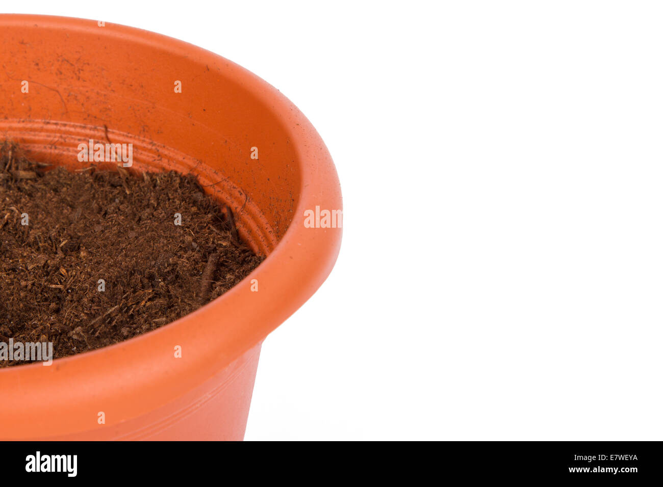 Detail view of flower pot and full of soil, isolated on white ...