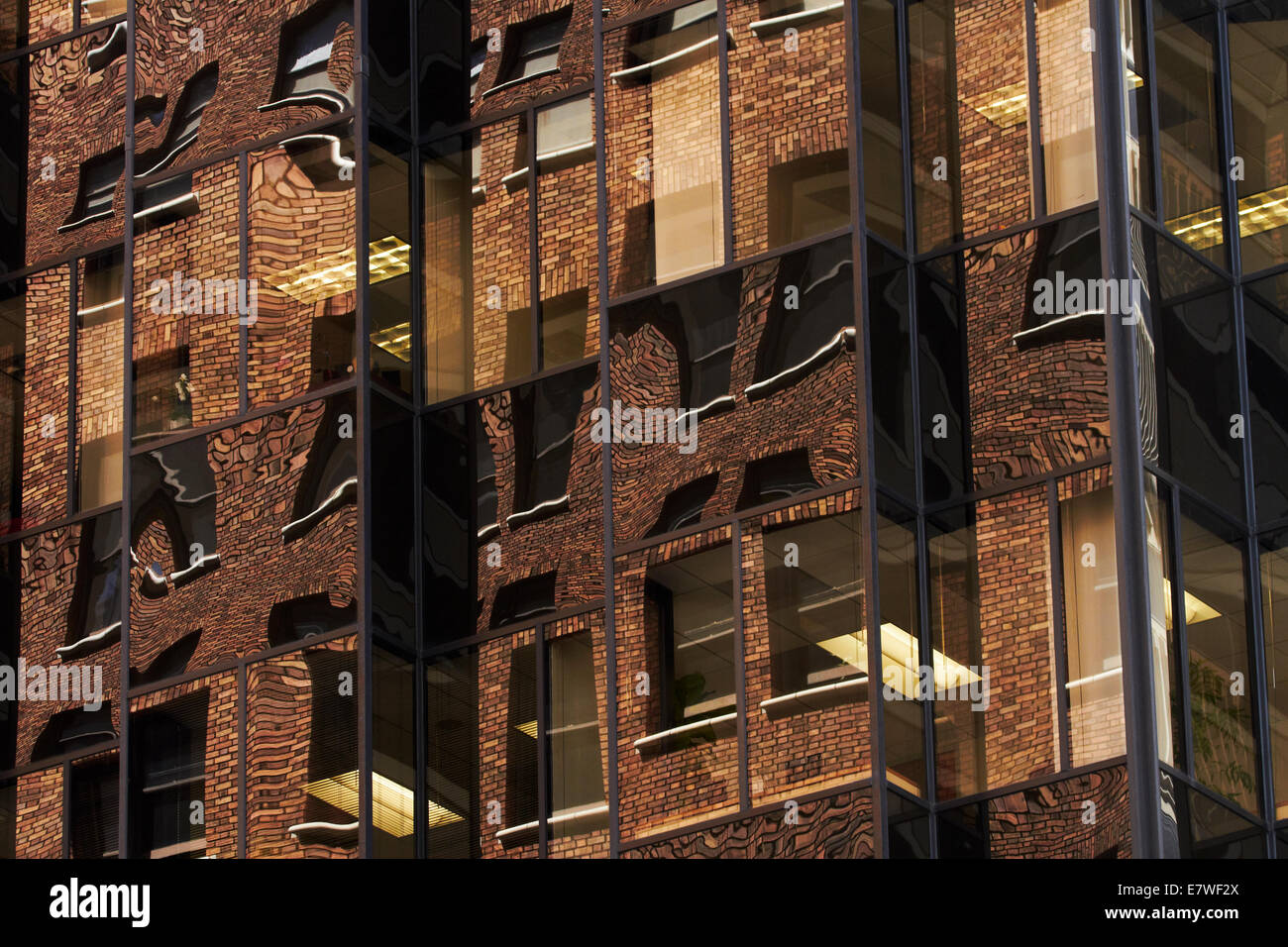 JH Dollar Building reflected in facade of office building at 425 ...