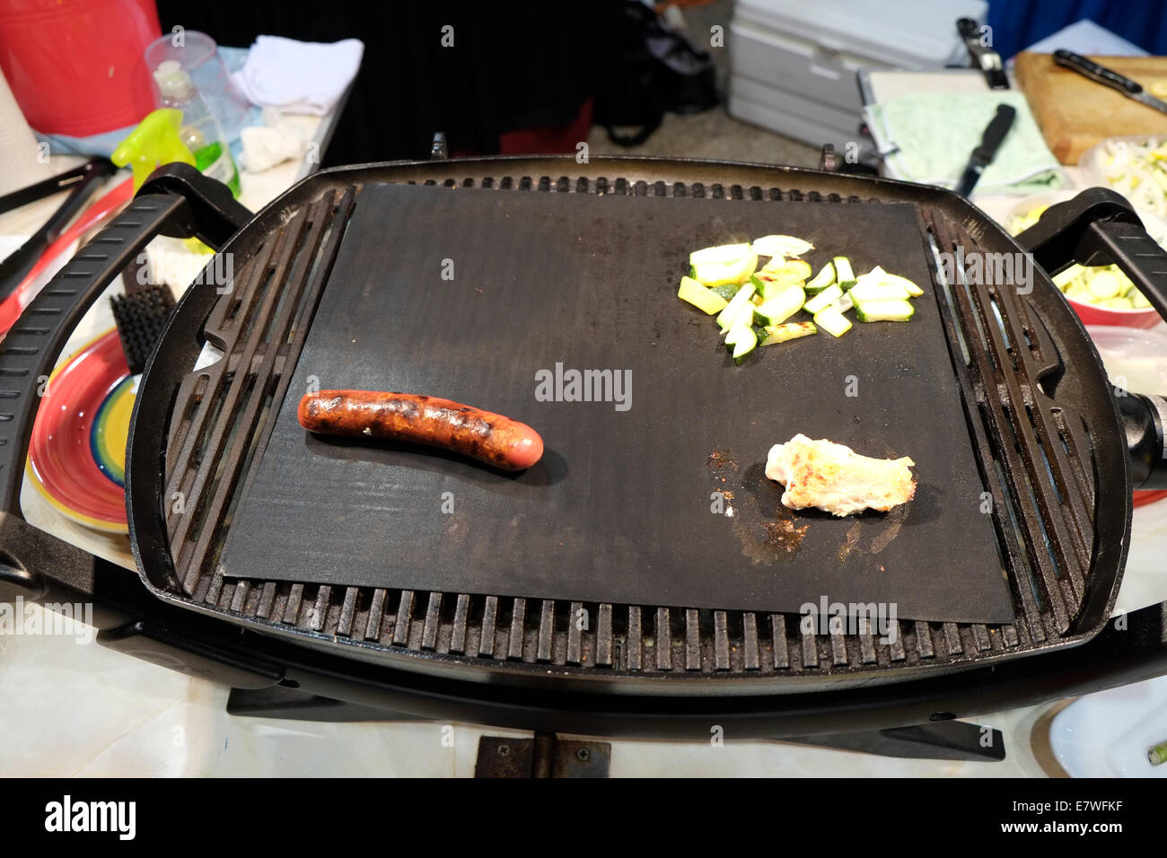 Hot dog cooking on an electric grill griddle Stock Photo - Alamy