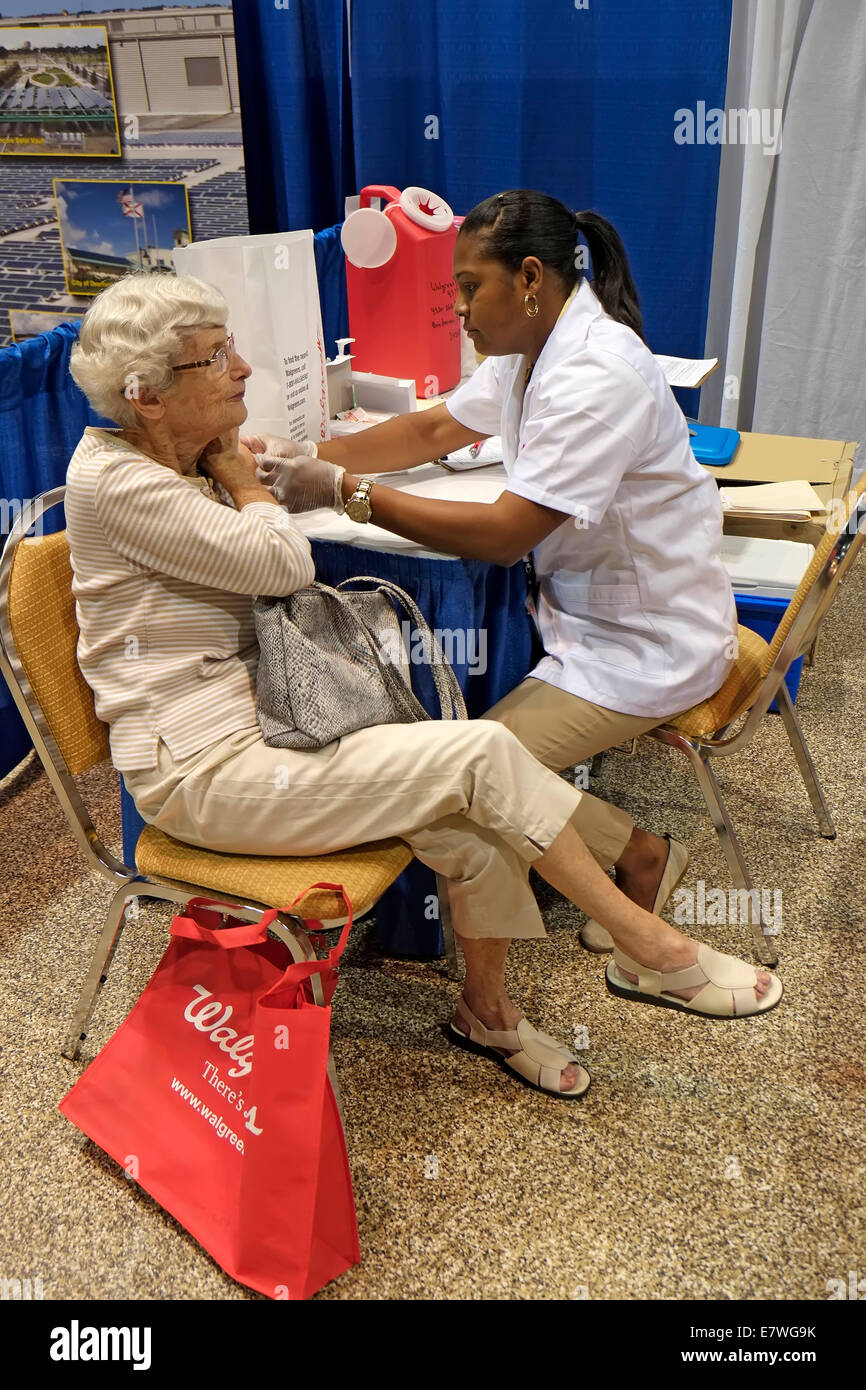 Senior female getting a flu shot Stock Photo - Alamy
