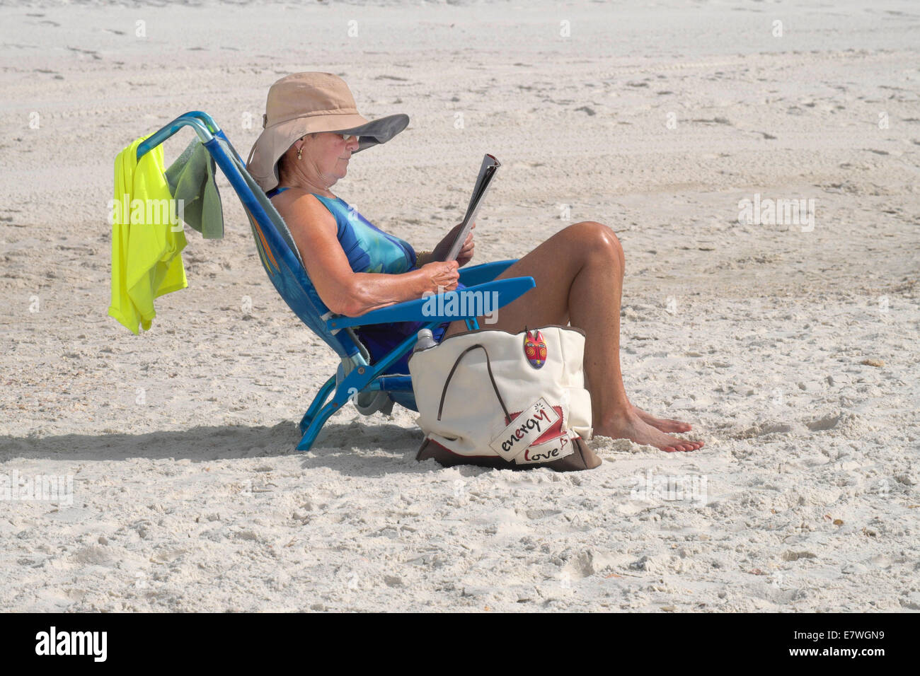Reading on the beach chair hi-res stock photography and images - Alamy