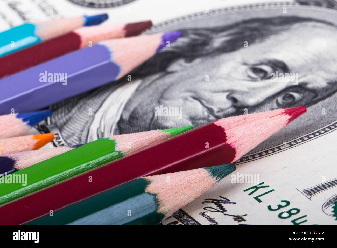Finance concept, colorful pencils on one hundred dollar banknote Stock ...