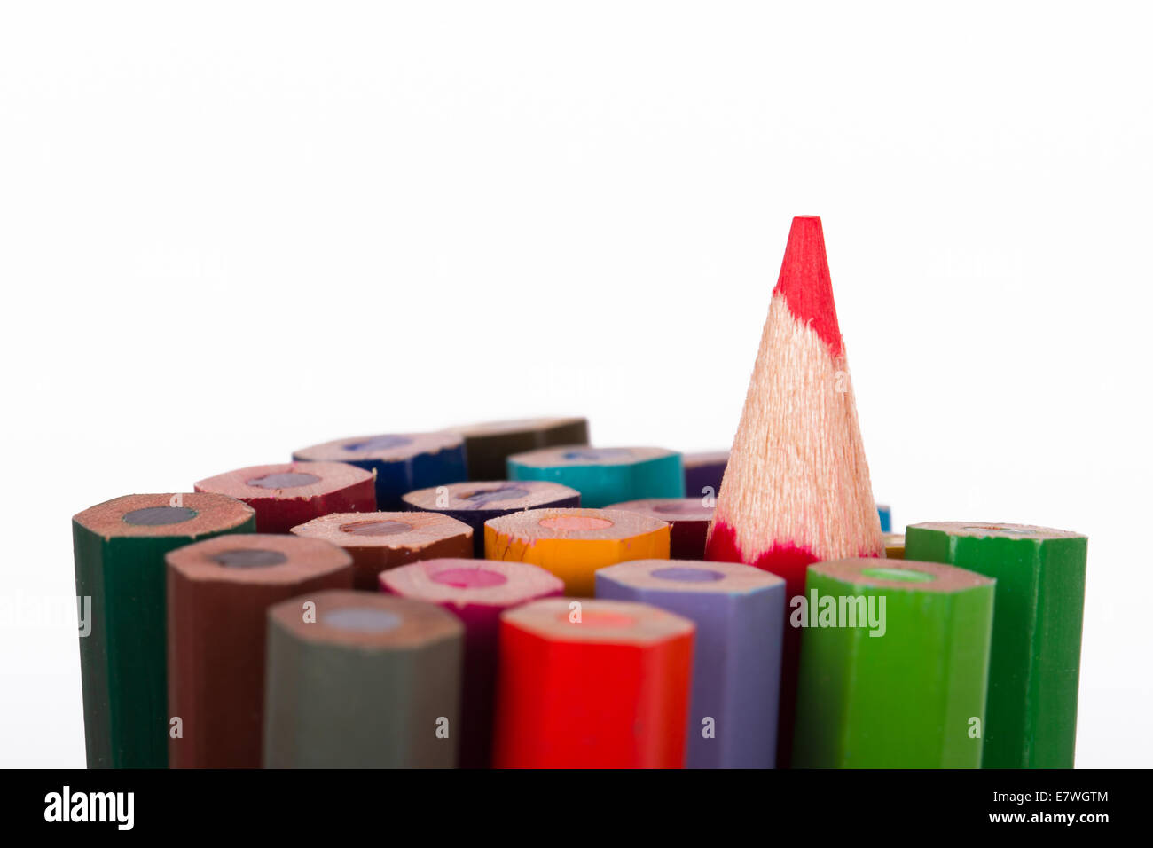 Red pencil standing out from colorful pencils, isolated on white ...
