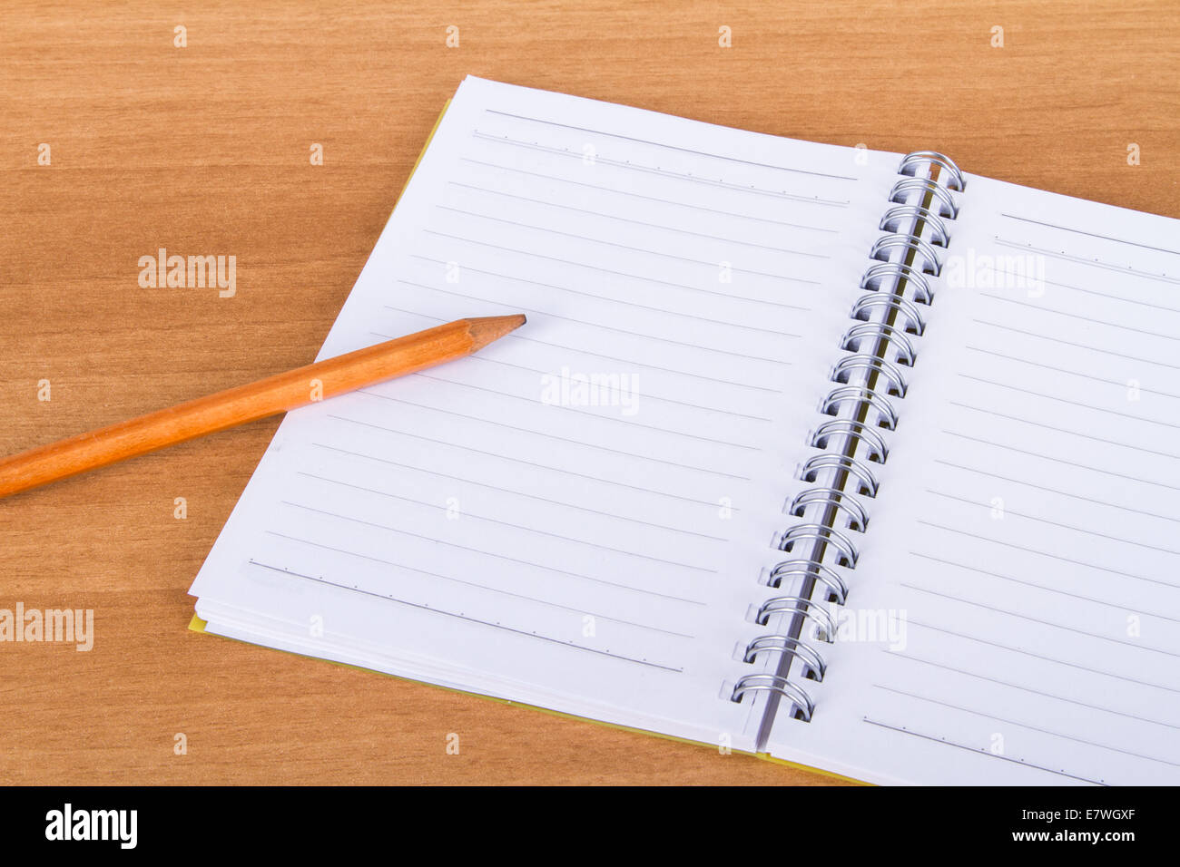 Blank, white, open notebook with pencil on wood background Stock Photo ...