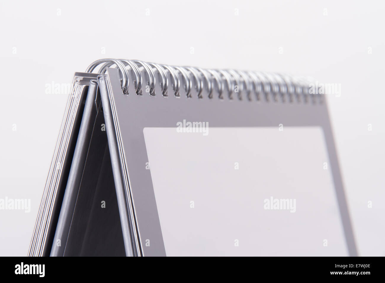 Close up view of blank desk calendar with gray frame, isolated on white ...