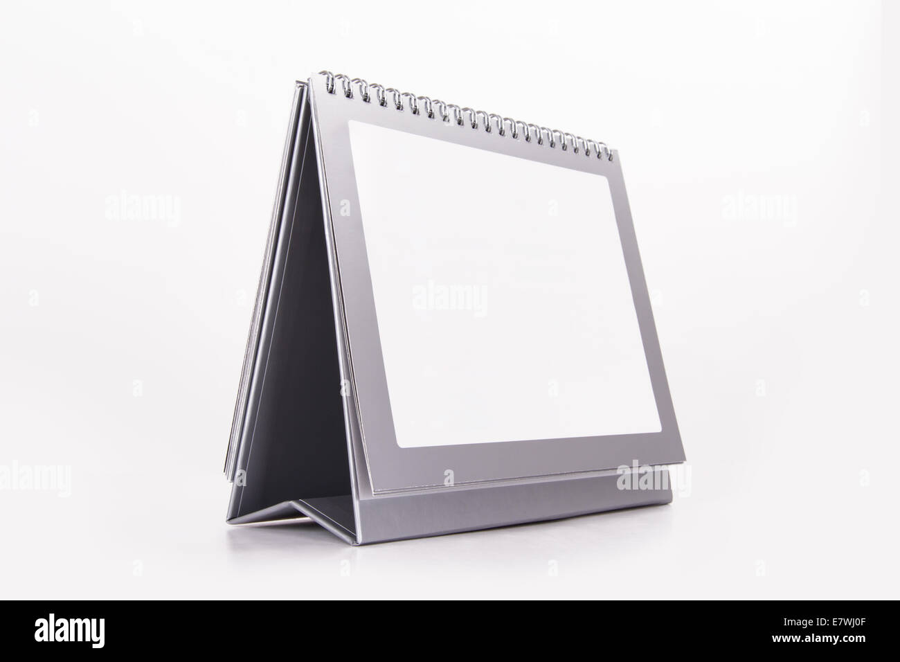 Blank standing desk calendar on perspective, isolated on white ...