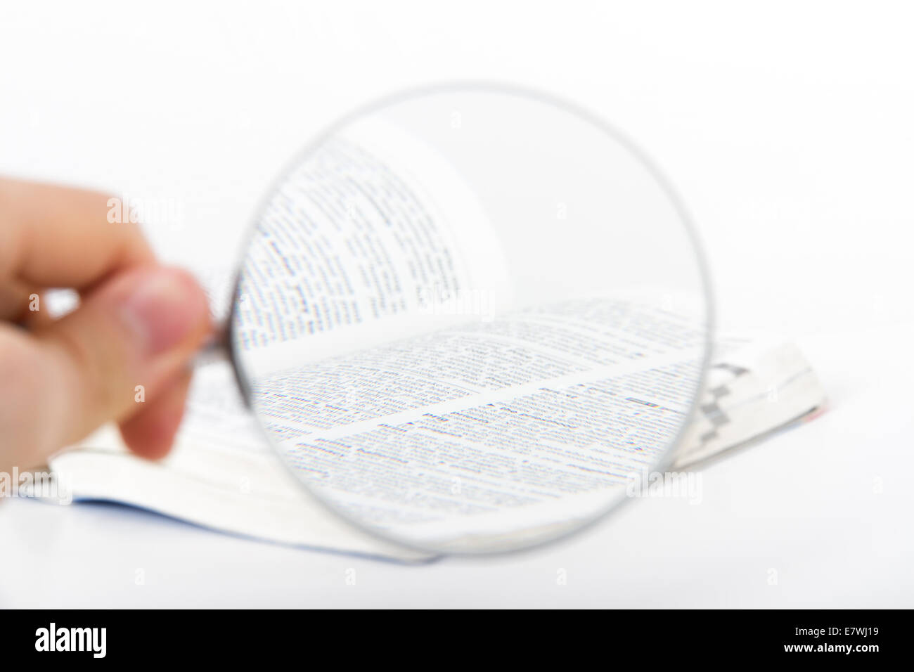 Classic style magnifying glass on open dictionary book, isolated on ...