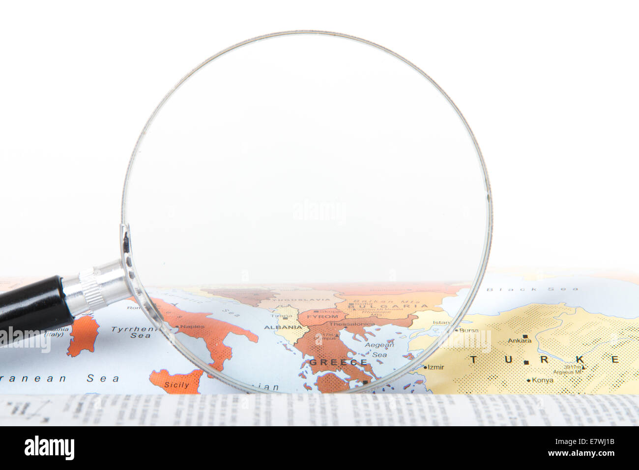 Classic style magnifying glass on open book, map of Europe, isolated on ...