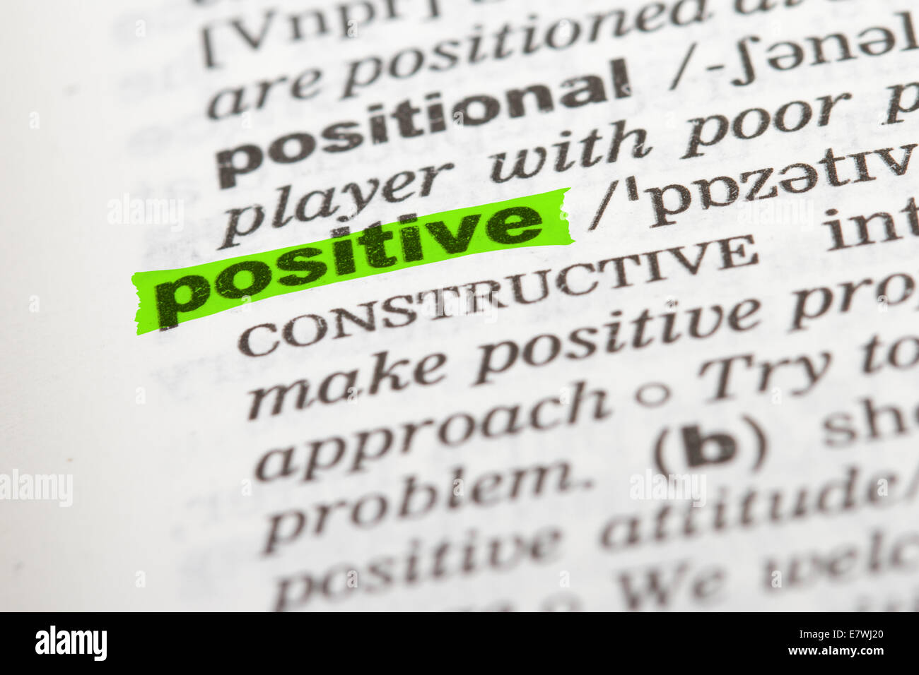 Positive word highlighted with green marker on dictionary page Stock ...