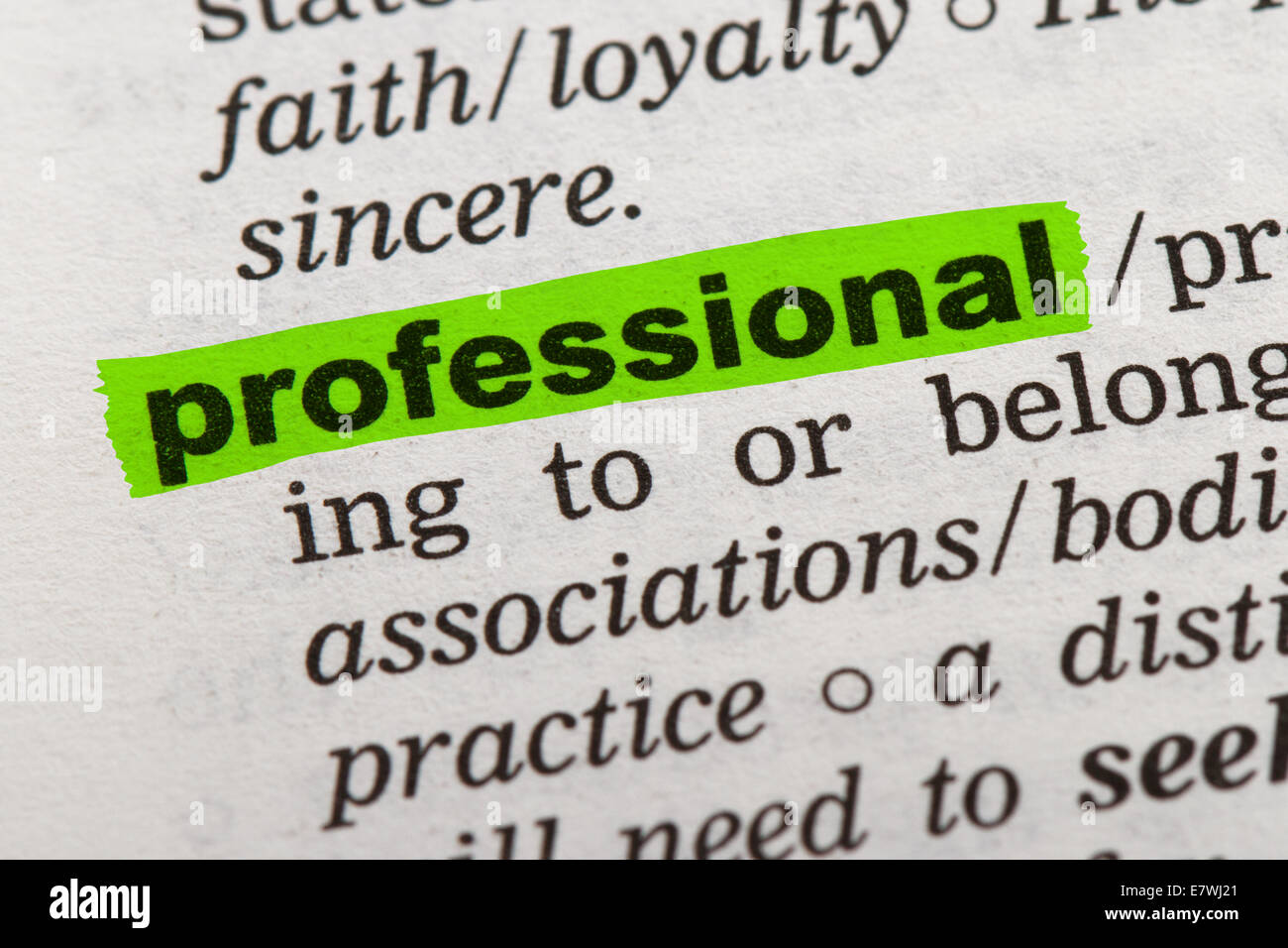 Professional word highlighted with green marker on dictionary page ...