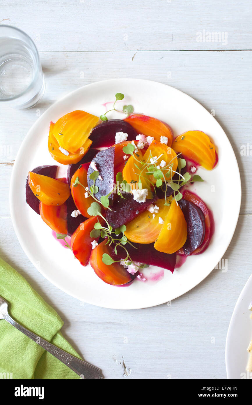 Colorful beet salad plated on white plate and backdrop Stock Photo - Alamy