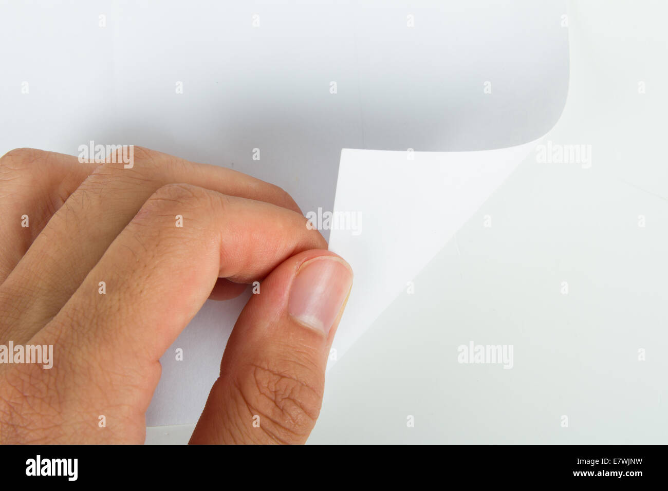 Hand turning blank page, isolated on white background Stock Photo - Alamy