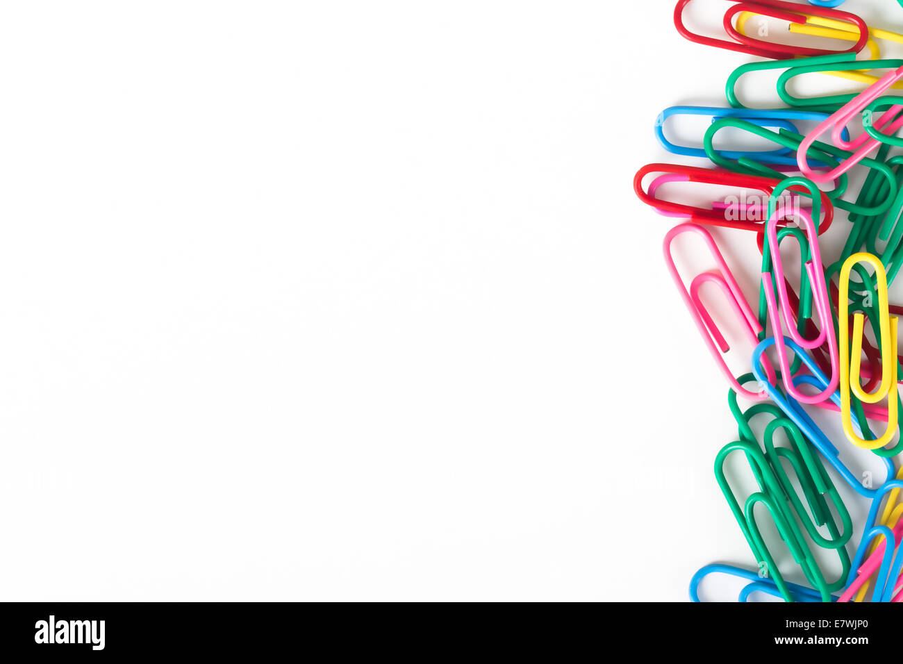 Multi colored paper clips with space, isolated on white background ...