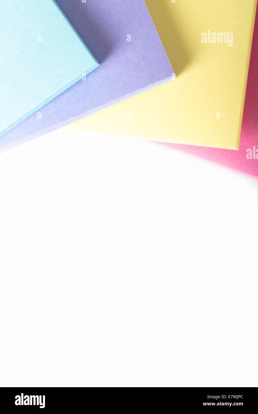 Multi colored sticky post it notes with space, isolated on white ...