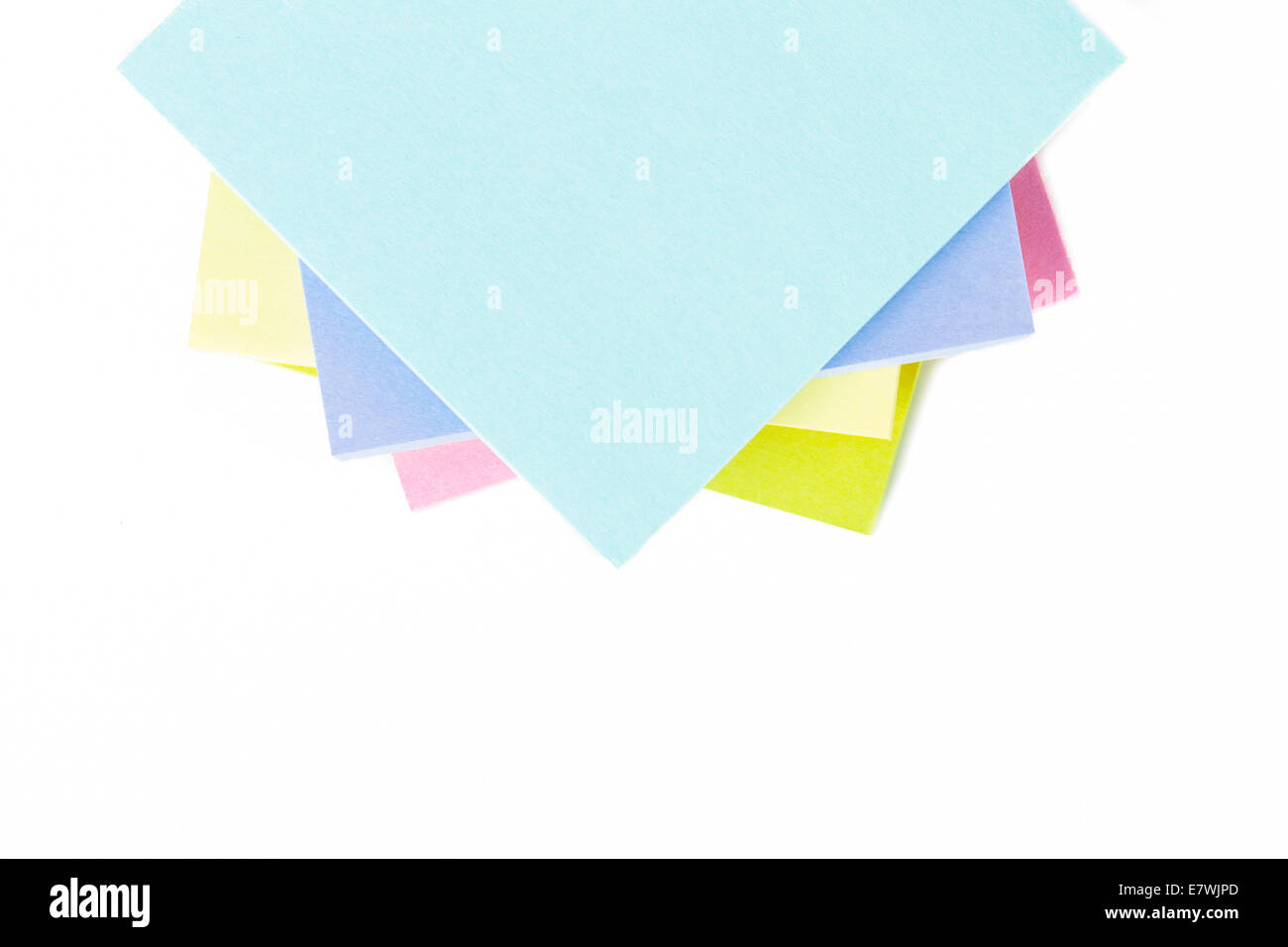 Stack of multi colored sticky post it notes with space, isolated on ...