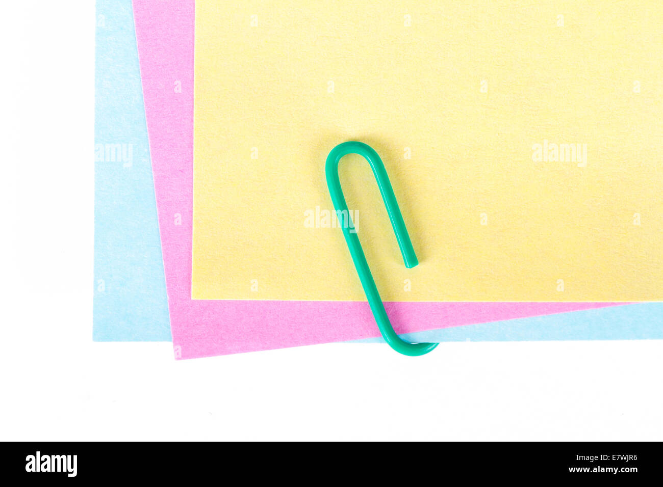 Paper clip on colorful sticky post it notes, isolated on white ...