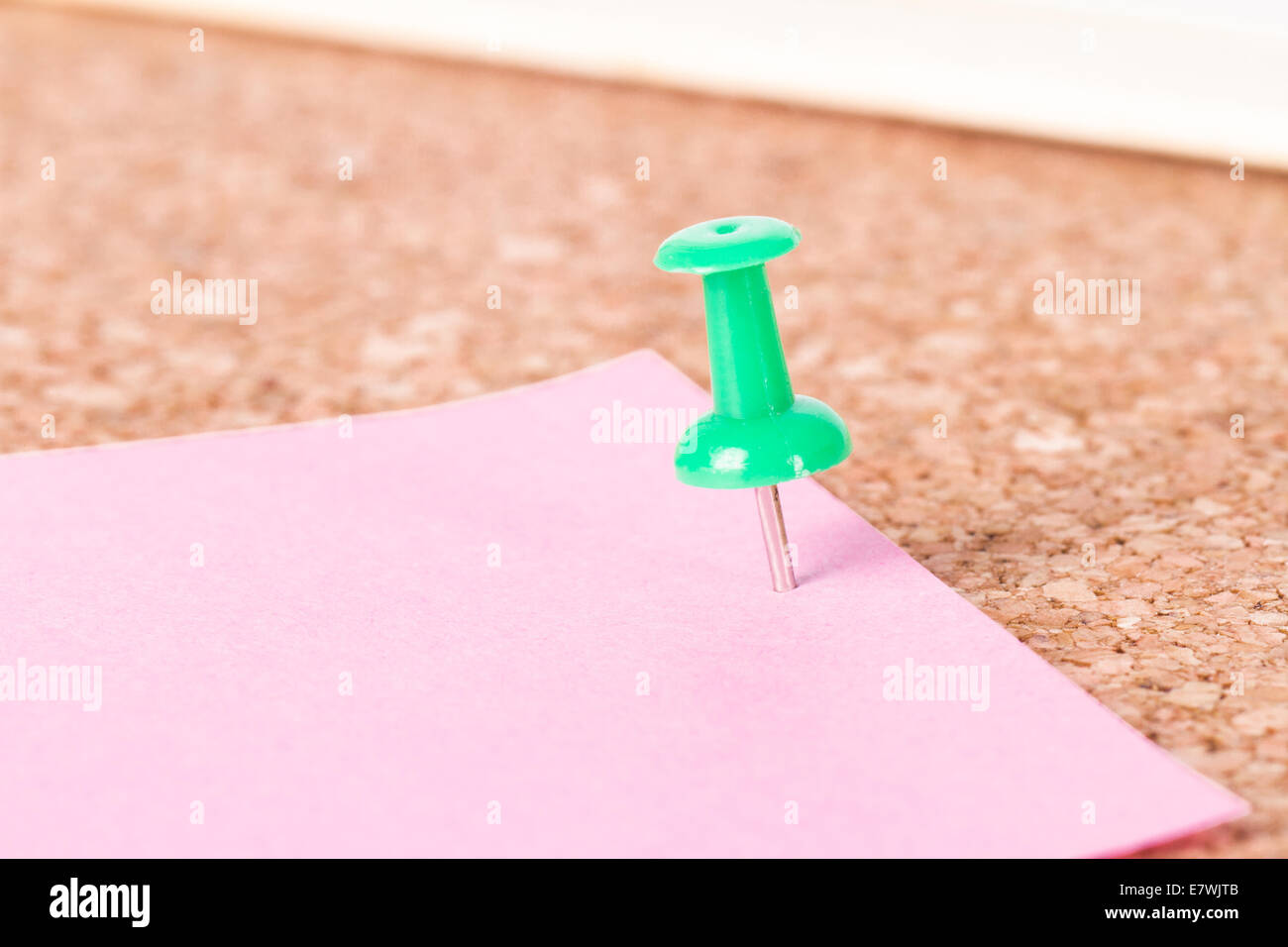 Green push pin and pink sticky post on cork bulletin board Stock Photo ...