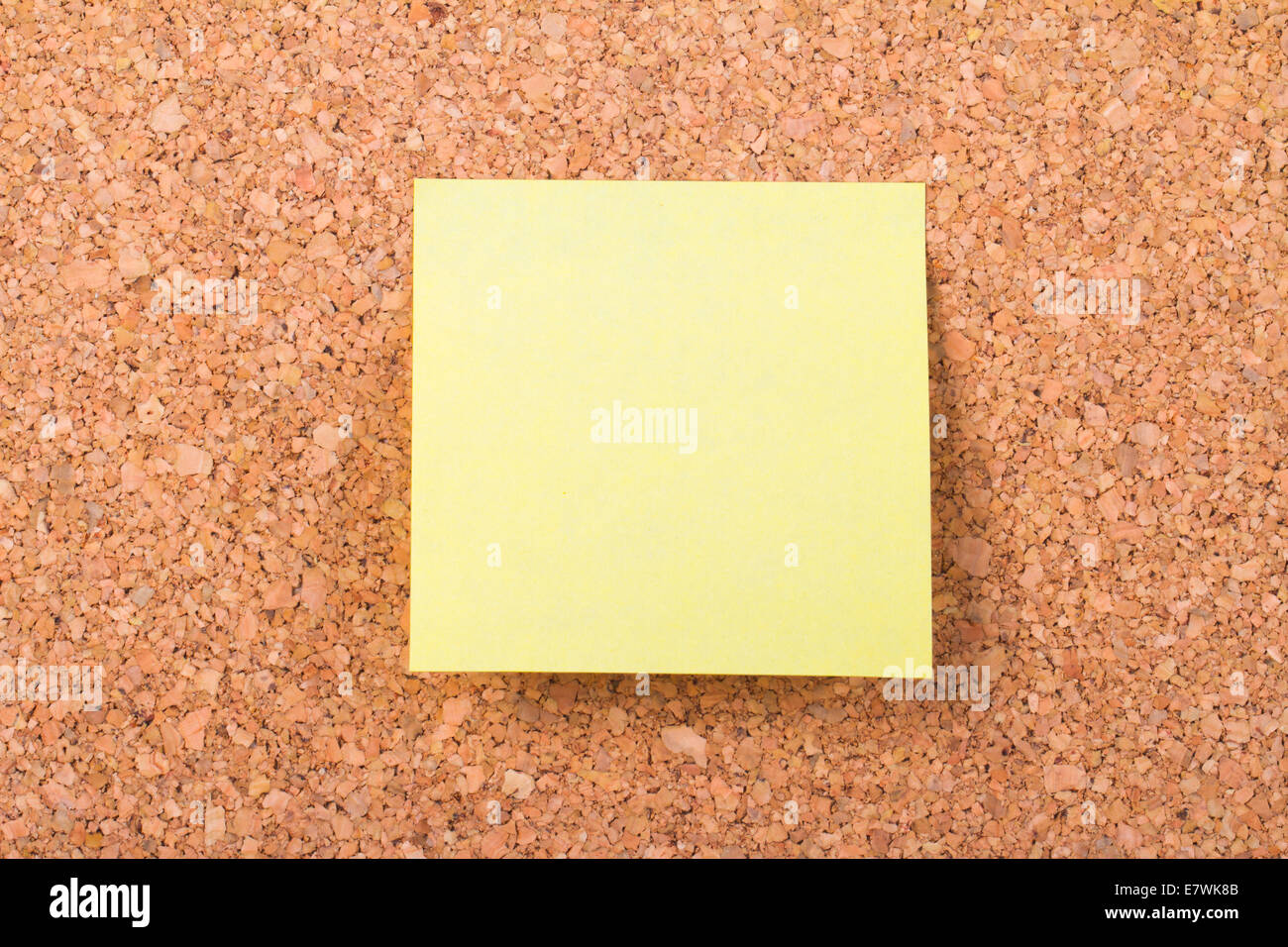 Blank, empty, yellow sticky post it note on cork bulletin board Stock ...