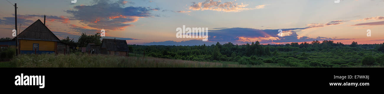 Sunset over village Stock Photo - Alamy