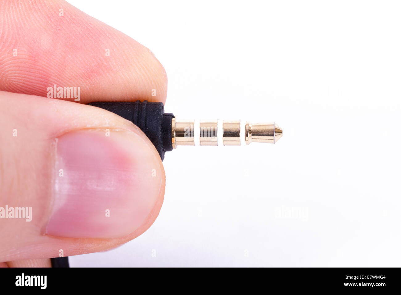 Hand holding stereo cable, isolated on white background Stock Photo - Alamy