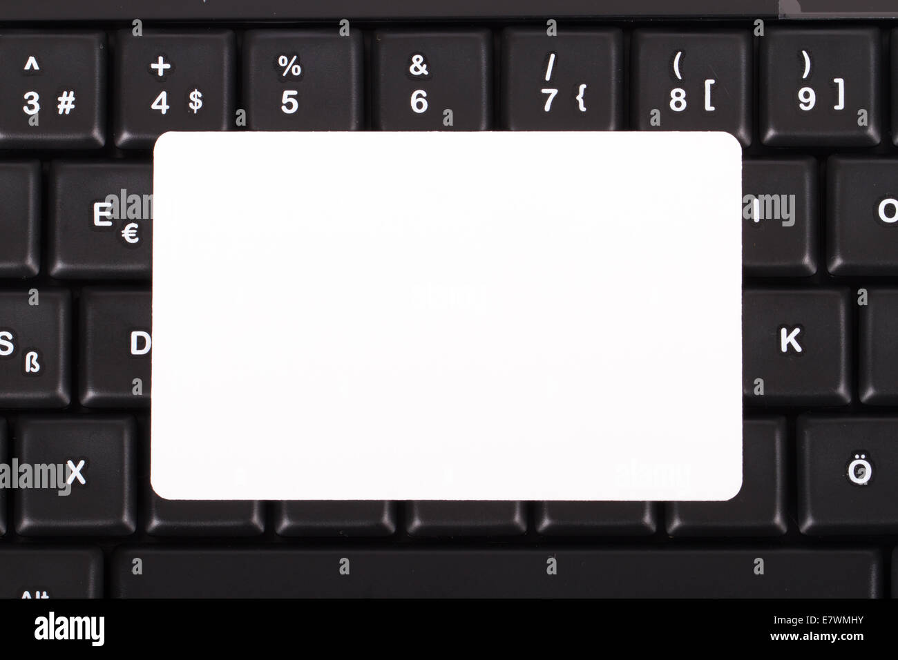 Blank, white card on black computer keyboard buttons, top view Stock ...