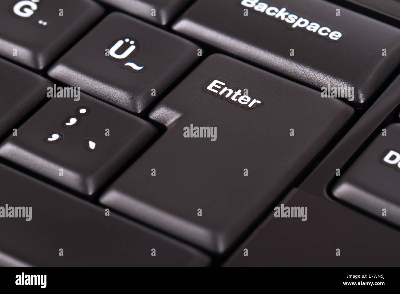 Enter button on black keyboard Stock Photo - Alamy
