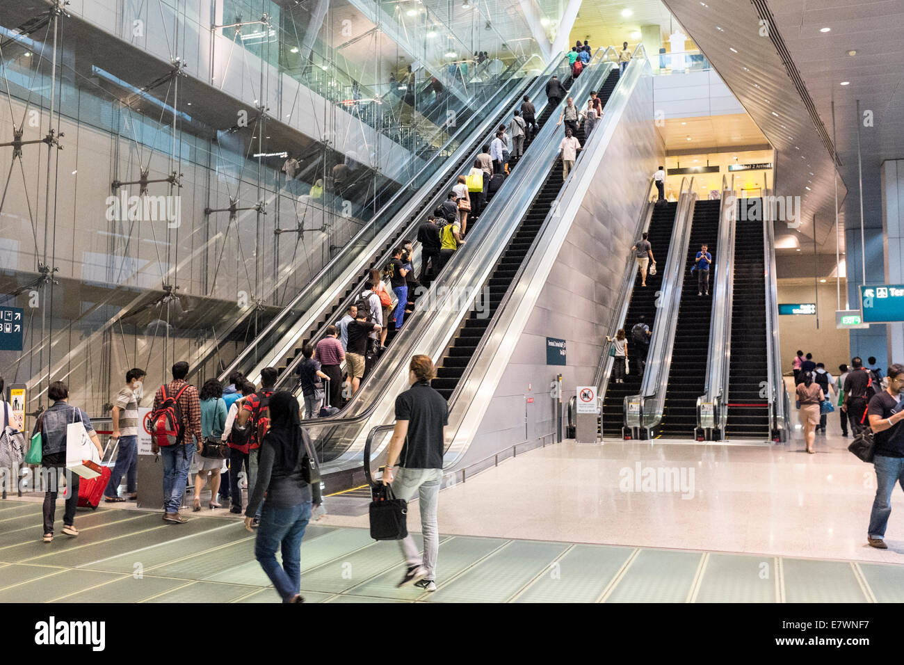 People arrive at the Changi Airport MRT station in Singapore Stock ...