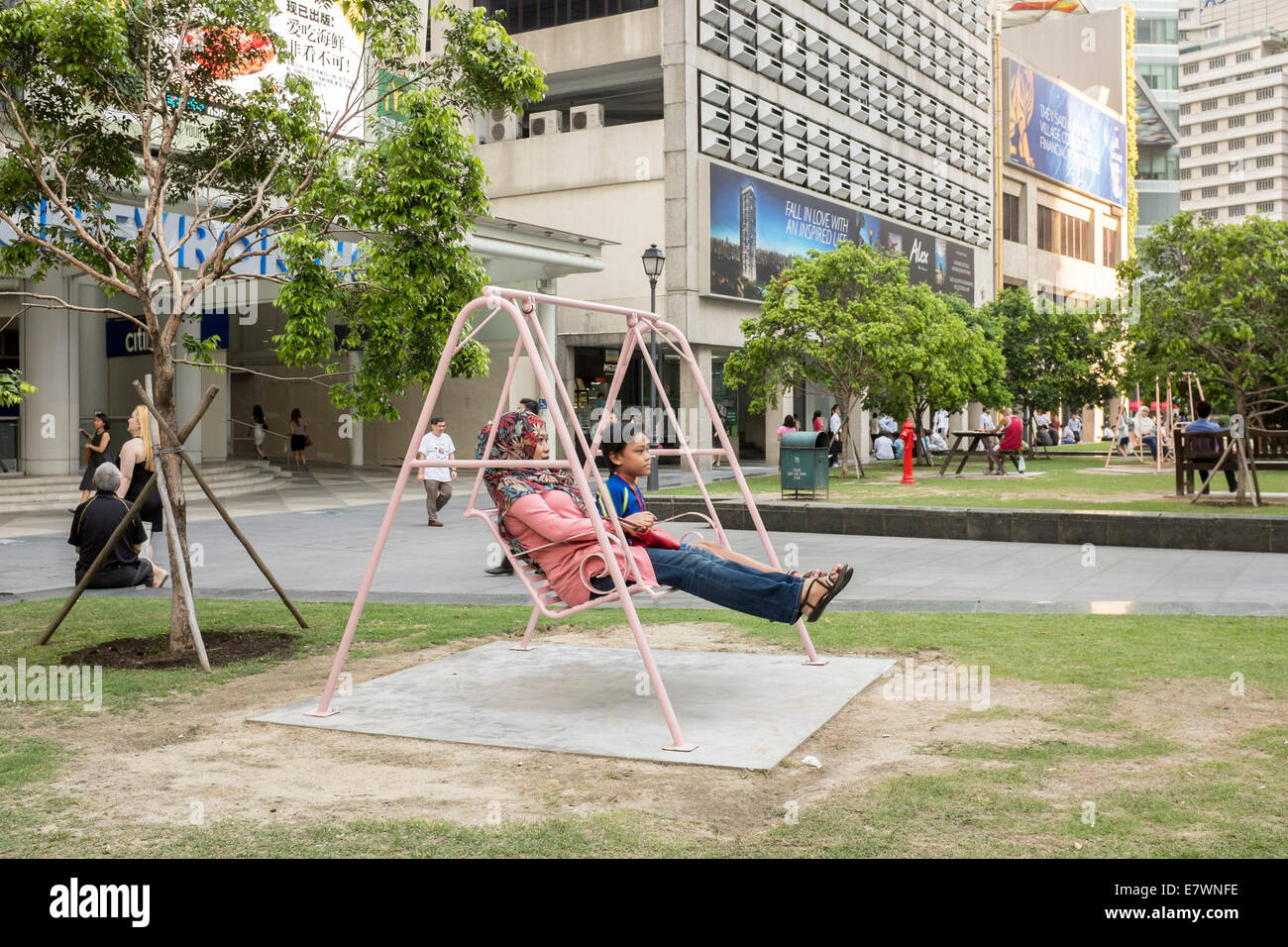 Raffles city you are not alone swing hi-res stock photography and ...