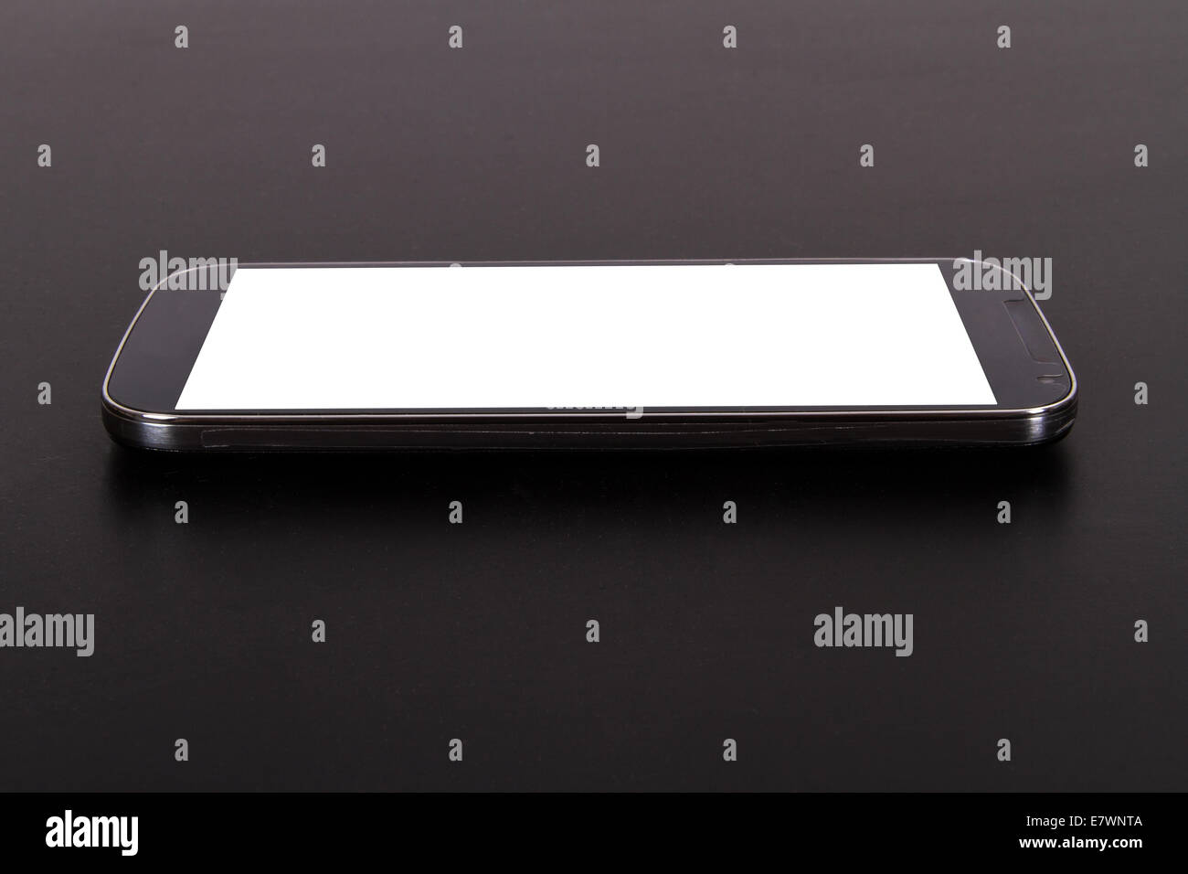 Smart phone with blank, white screen, side view on wooden table Stock ...