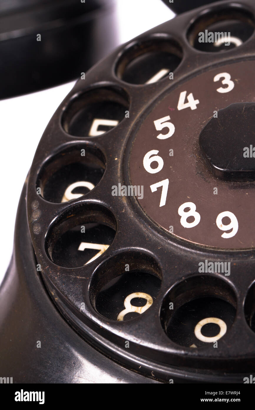Close up view, rotary dial of black vintage phone, isolated on white ...
