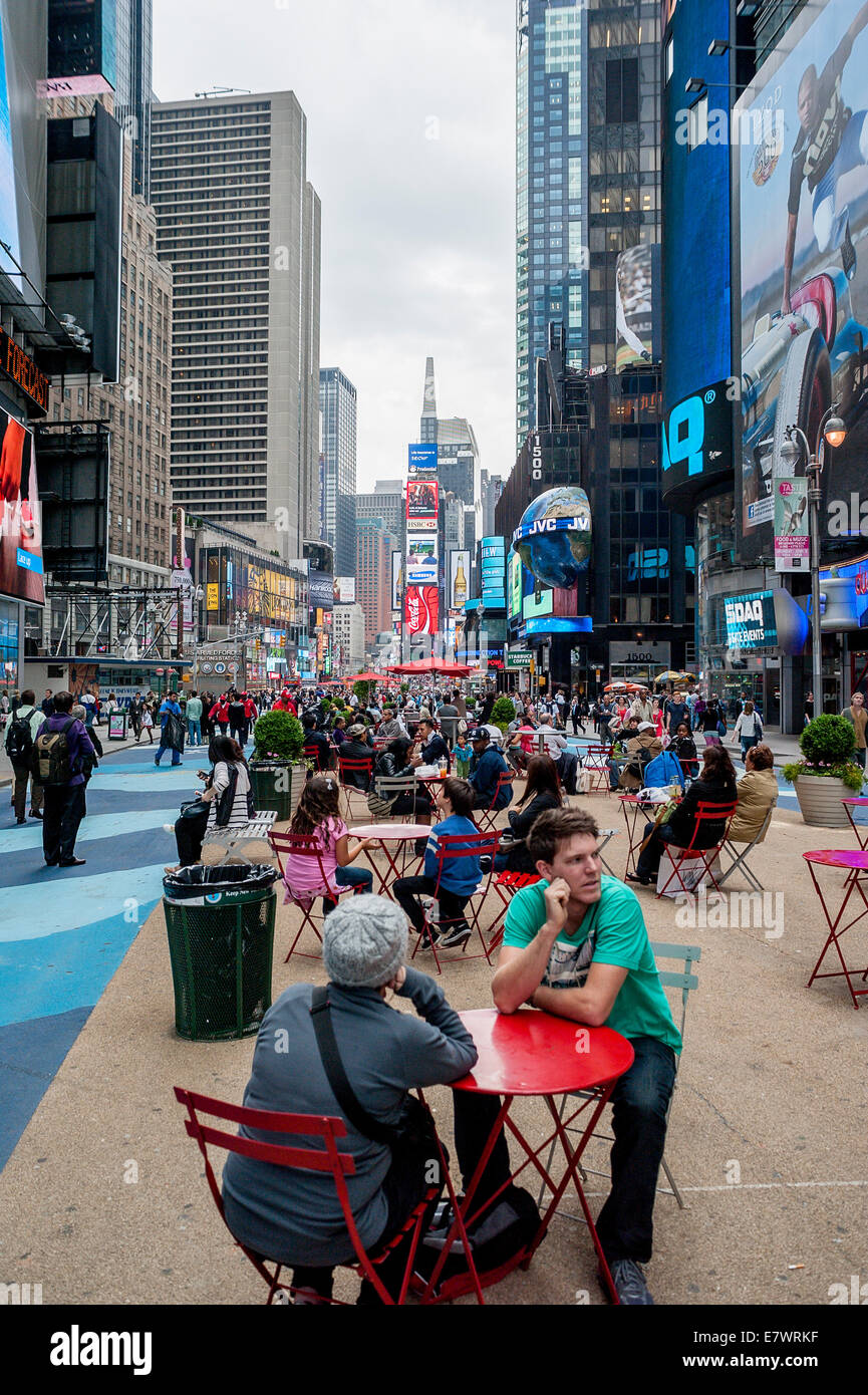 Tourists soak up the atmosphere in Times Square New York City Stock ...