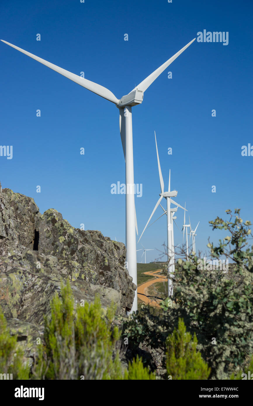 Wind turbines, track and rocks in the countryside Stock Photo - Alamy