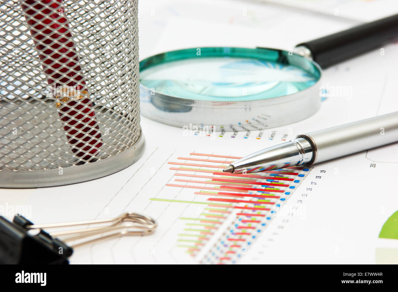pen, magnifying glass and the working paper with a diagram Stock Photo ...