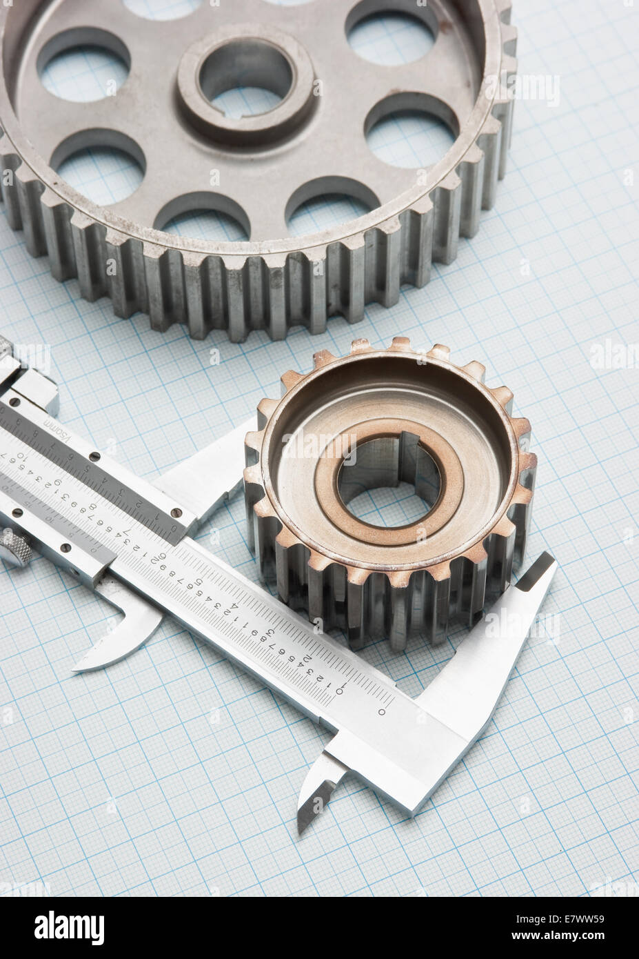 gears and caliper on graph paper Stock Photo - Alamy