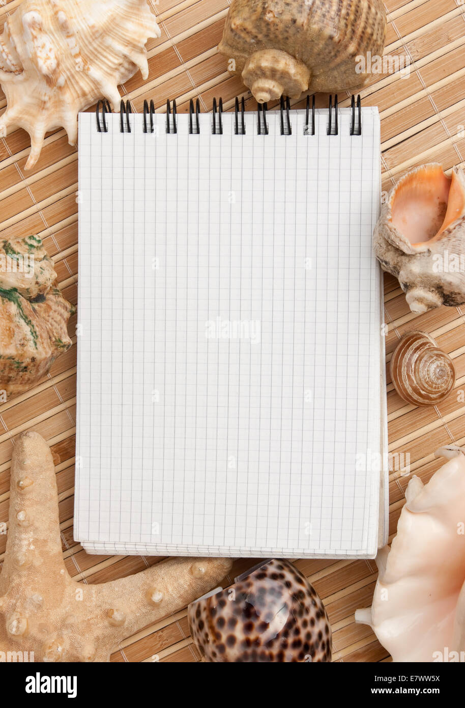 notebook on the background of mats and sea shells Stock Photo - Alamy