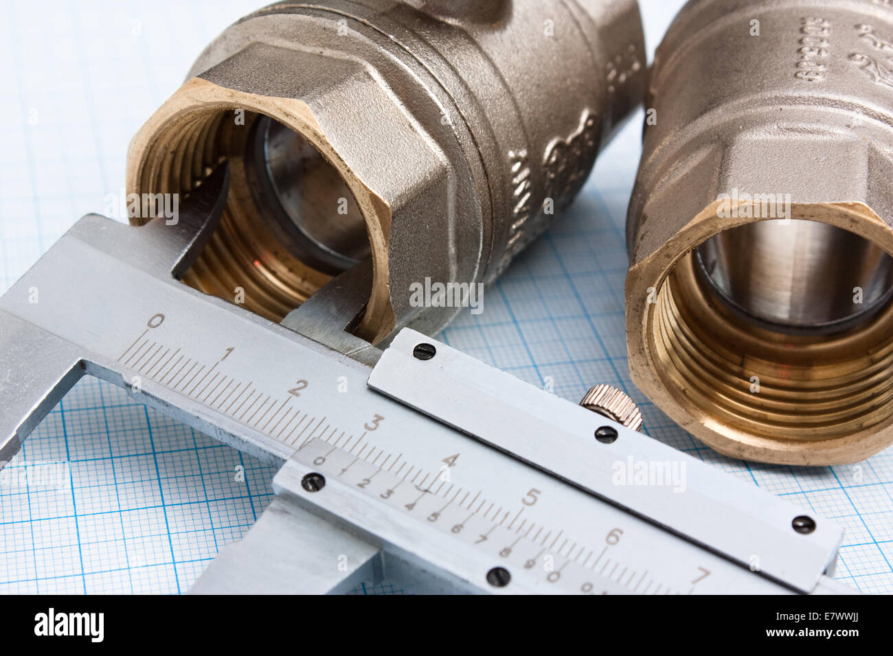 water inlet valve on a background of graph paper Stock Photo - Alamy